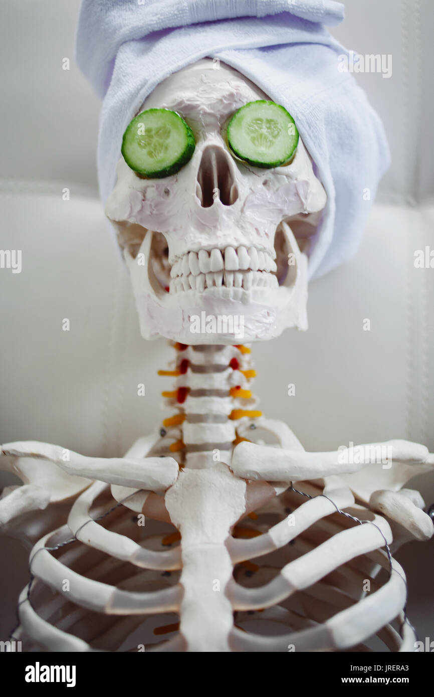 Skeleton in Spa salon with towel on her head and mask on her face ...