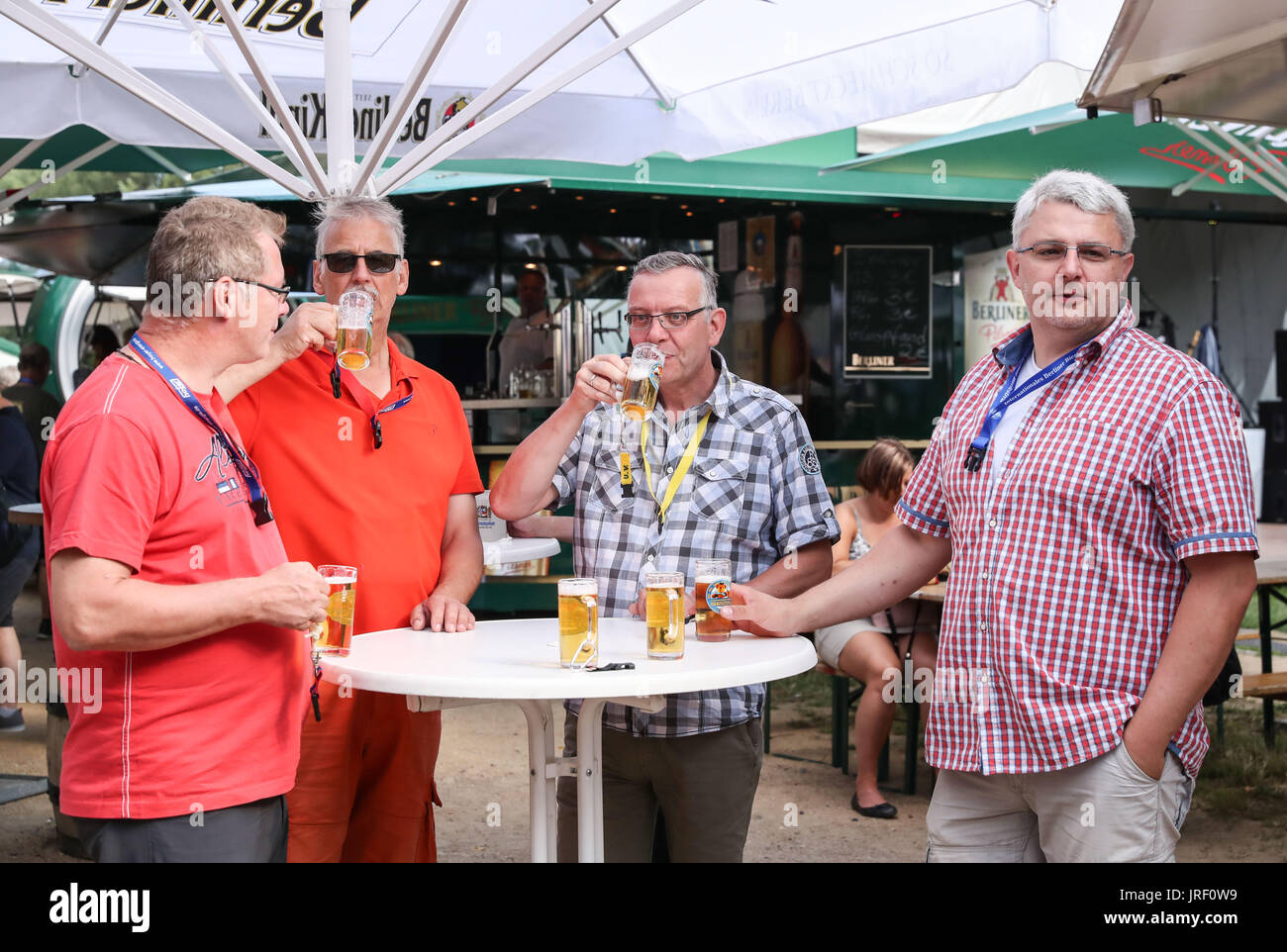 Berlin, Germany. 4th Aug, 2017. Visitors taste beer at a shop during ...