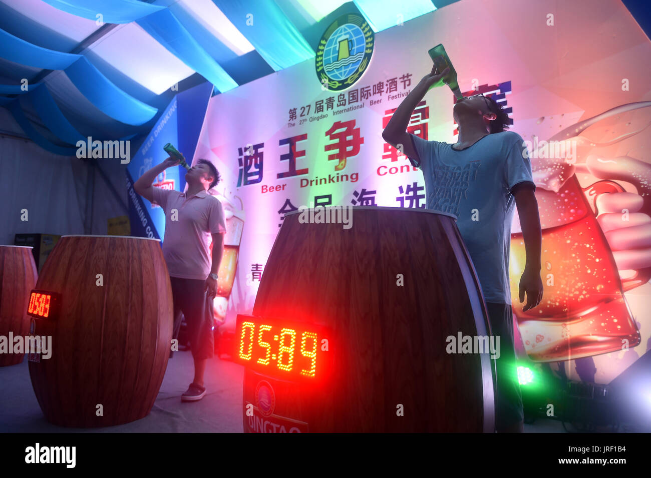 Qingdao. 5th Aug, 2017. People attend beer drinking contest during the ...