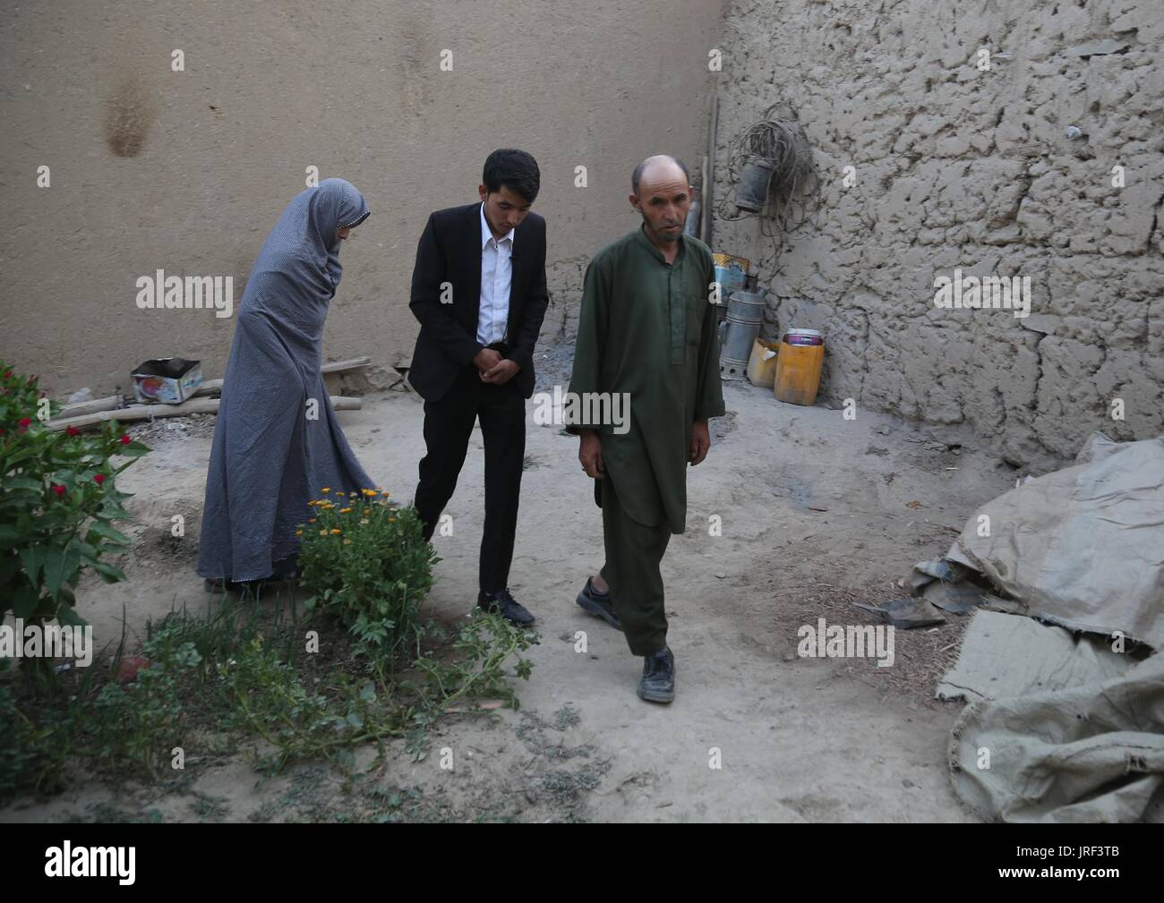 Kabul, Afghanistan. 2nd Aug, 2017. Mohammad Reza Rafat(C) walks with ...