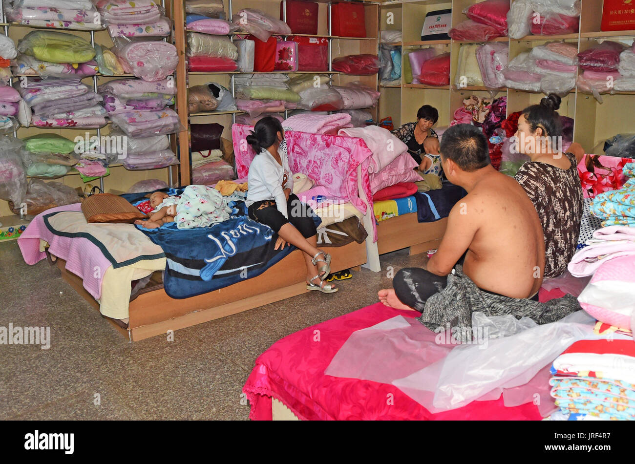 Xiuyan, China's Liaoning Province. 4th Aug, 2017. Villagers rest at a ...