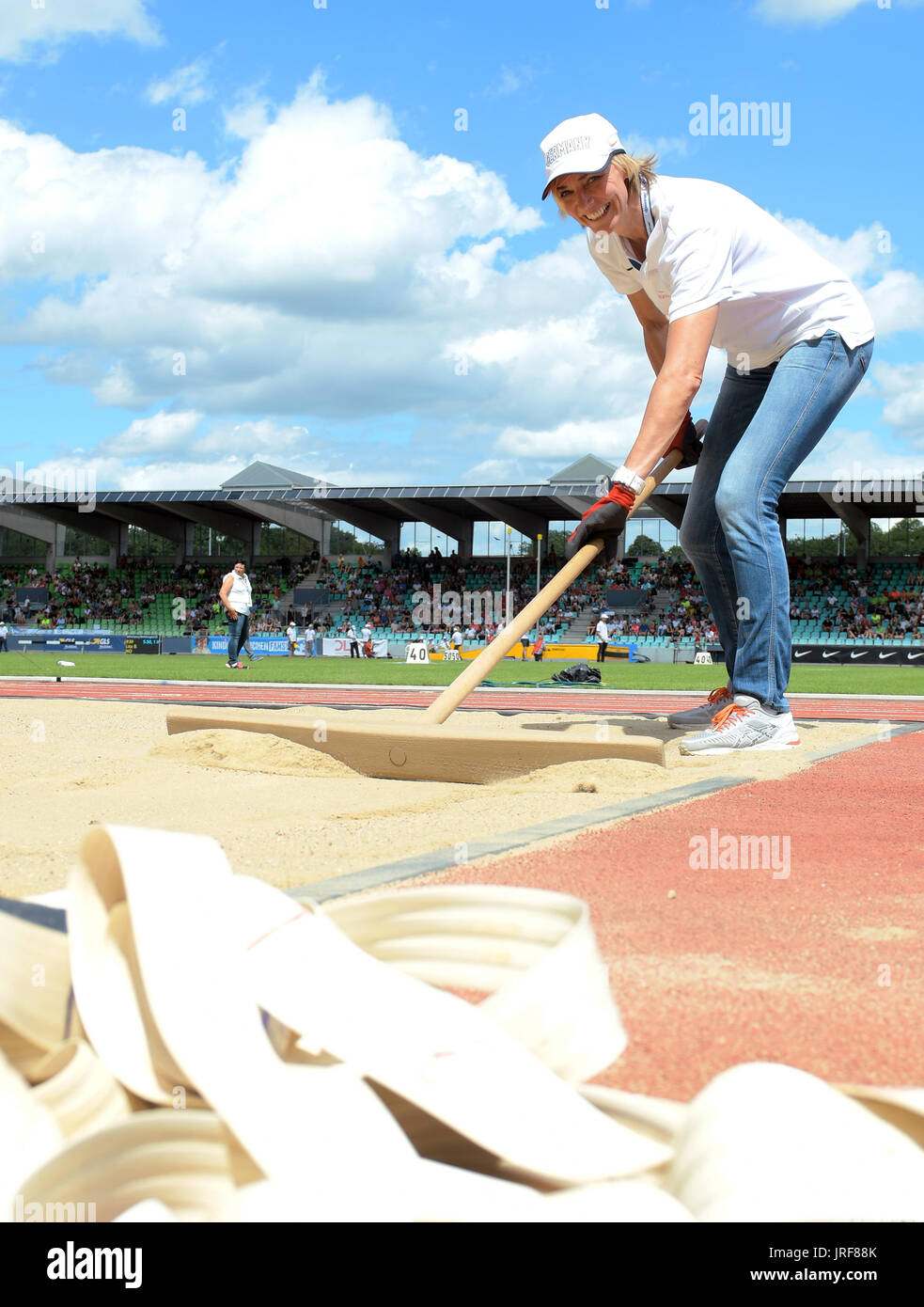 Ulm, Germany. 05th Aug, 2017. Heike Drechsler rakes sand in the long ...