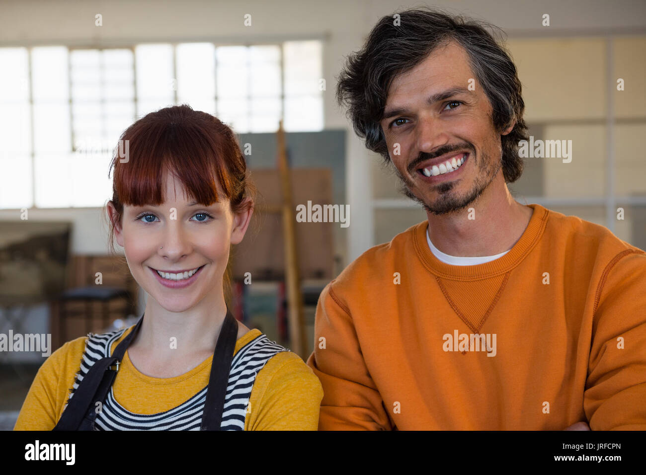 Portrait of smiling adult students in art class Stock Photo - Alamy