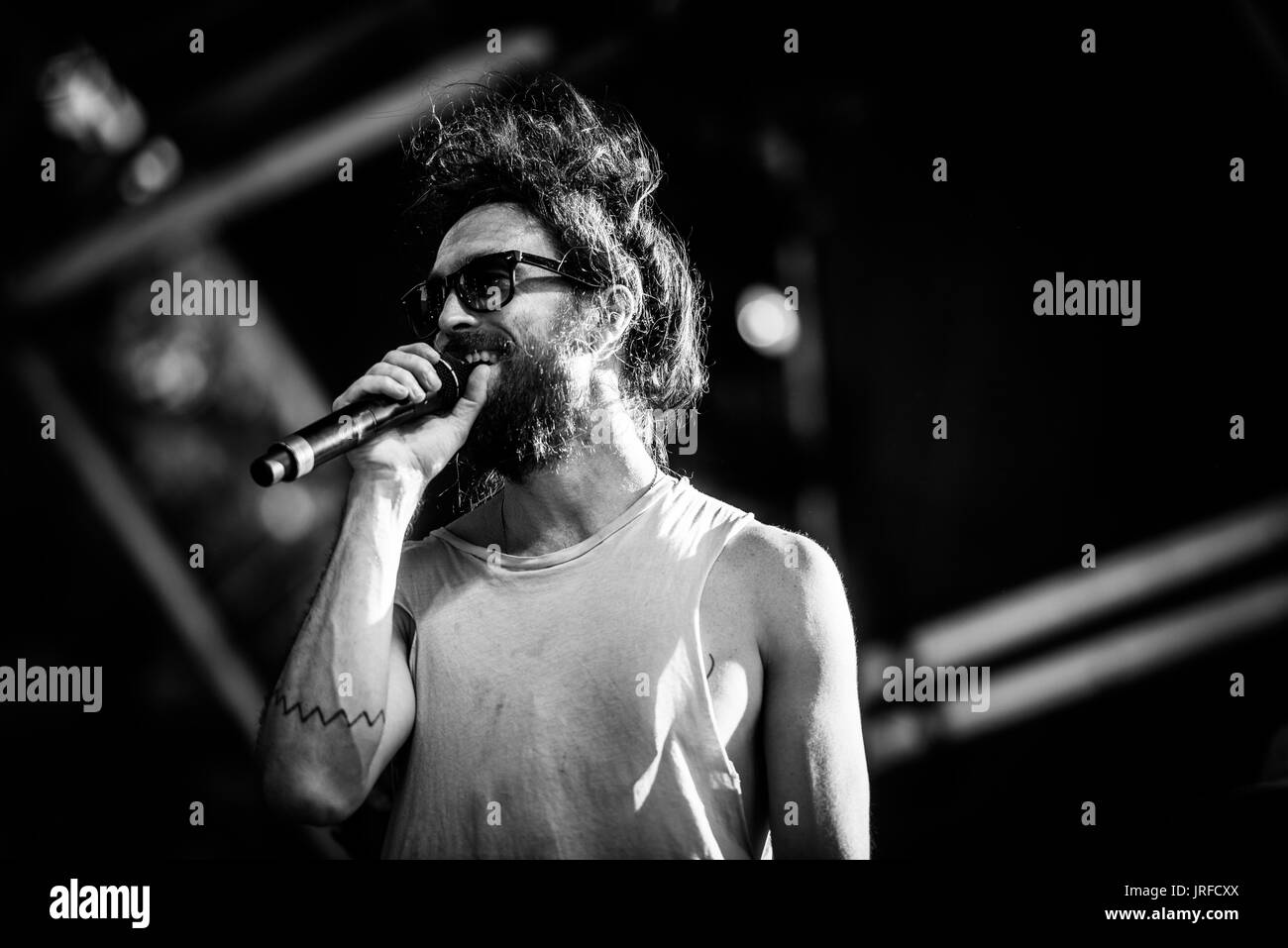 Edward Sharpe and the Magnetic Zeros performing at a music festival in ...