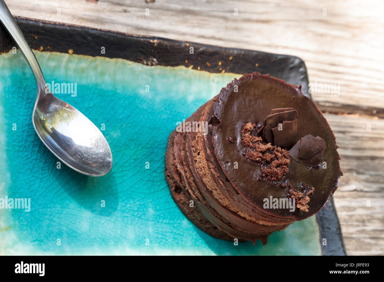 Creamy chocolate mousse layered cake with rich fudge icing Stock Photo ...