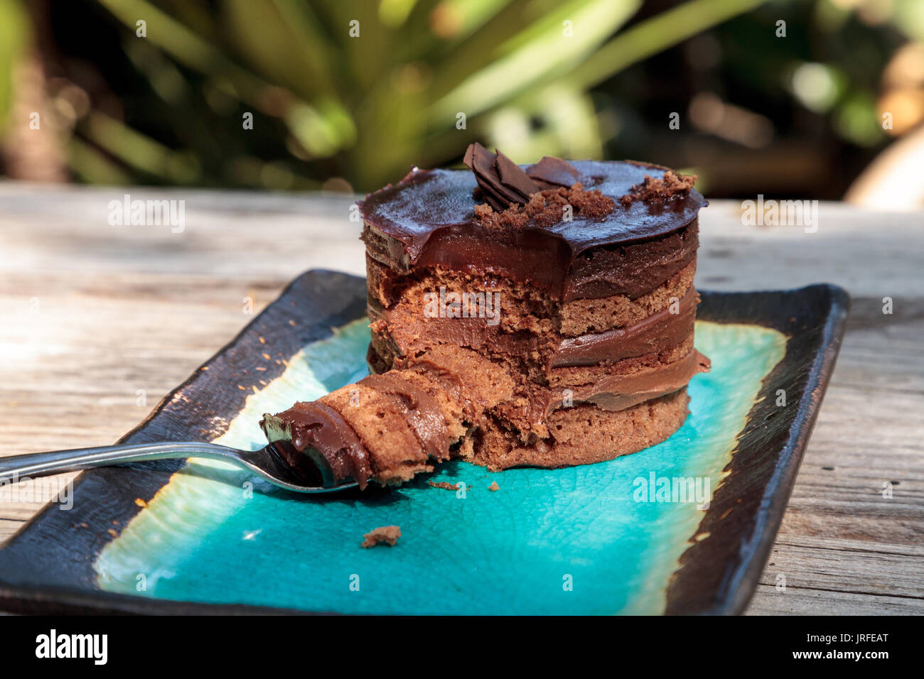 Creamy chocolate mousse layered cake with rich fudge icing Stock Photo ...