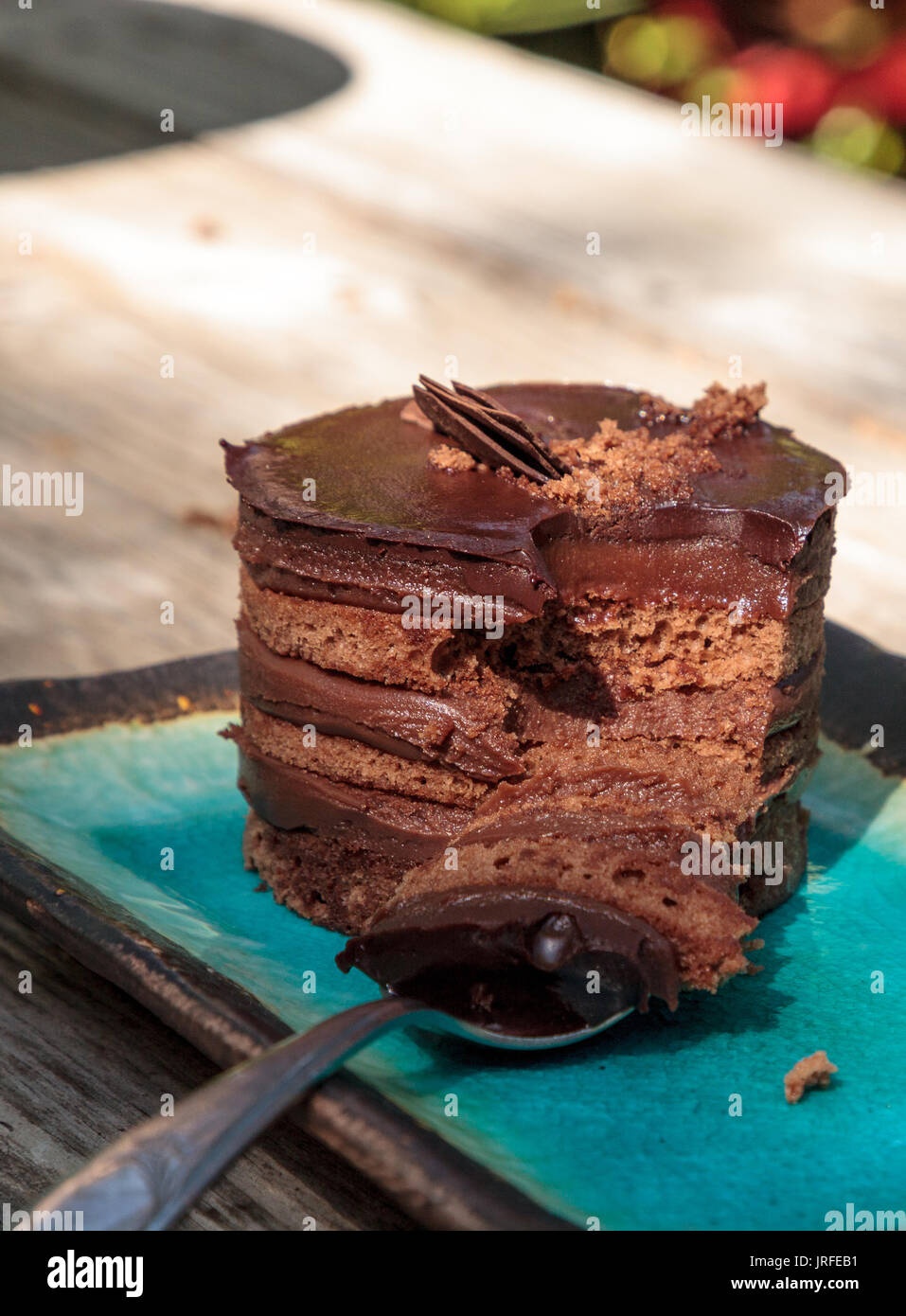 Creamy chocolate mousse layered cake with rich fudge icing Stock Photo ...