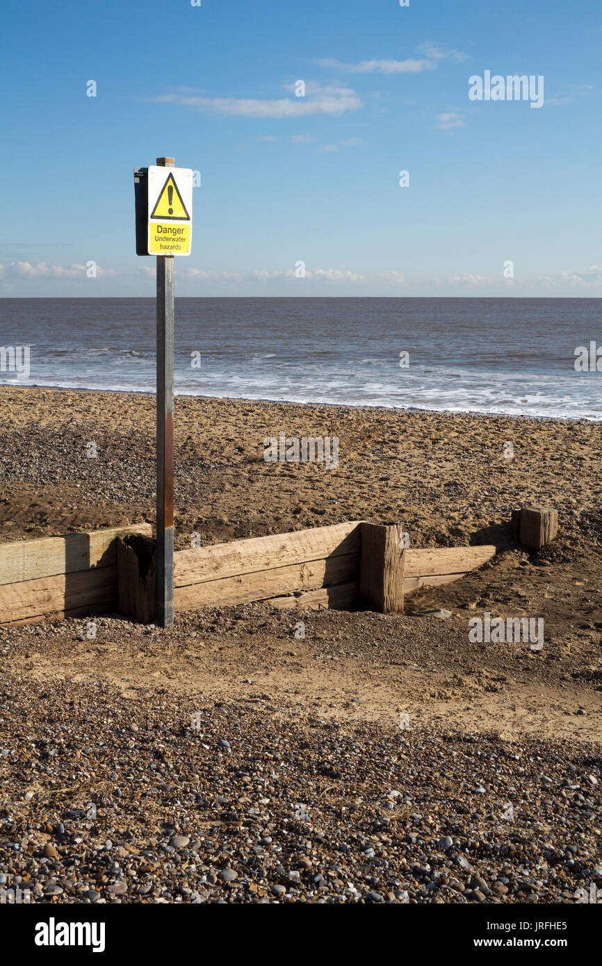 Danger sign warning of underwater hazards on Souhtwold beach Suffolk ...