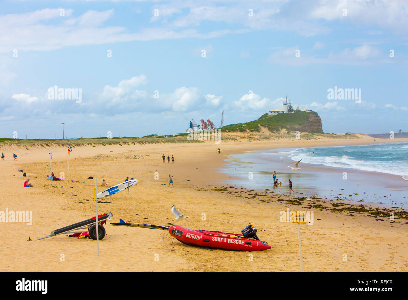 Nobbys Beach and nobbys head lighthouse in Newcastle, second largest ...