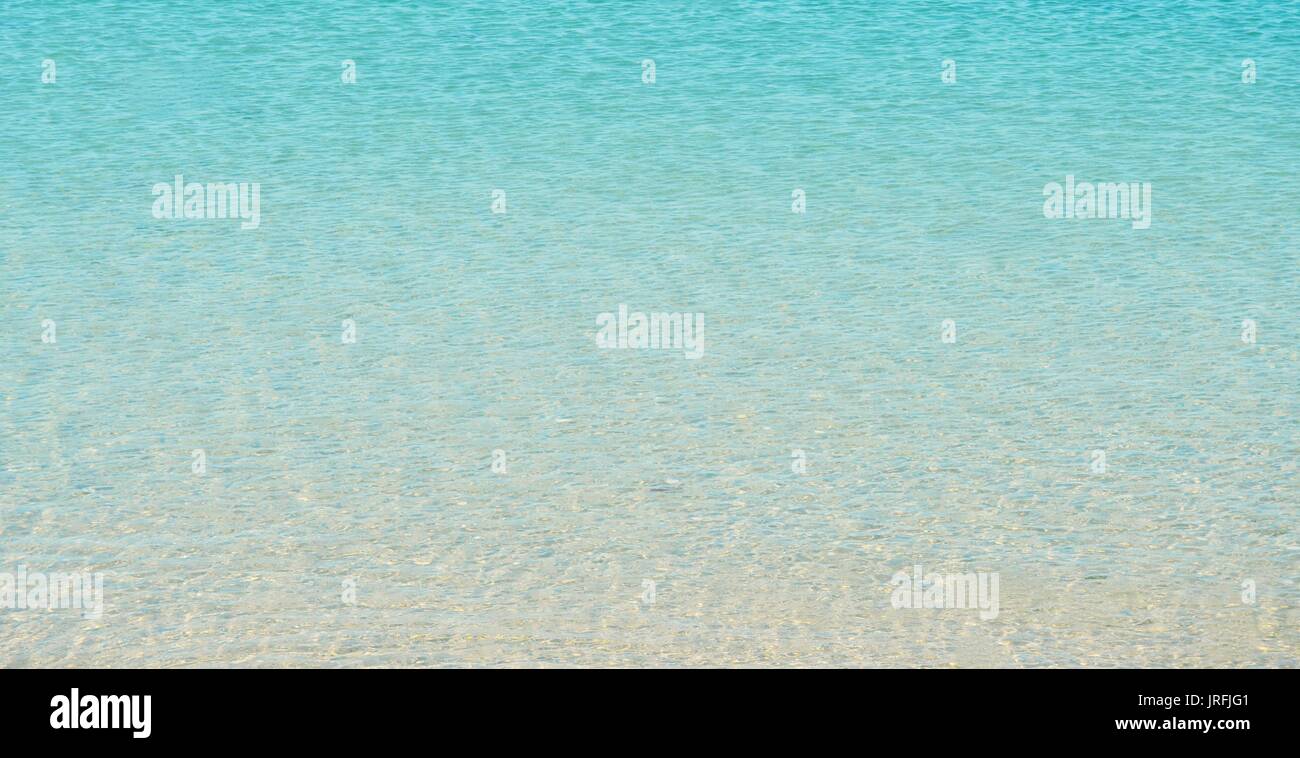 Clear tropical ocean water on a beach with natural gradient from ...