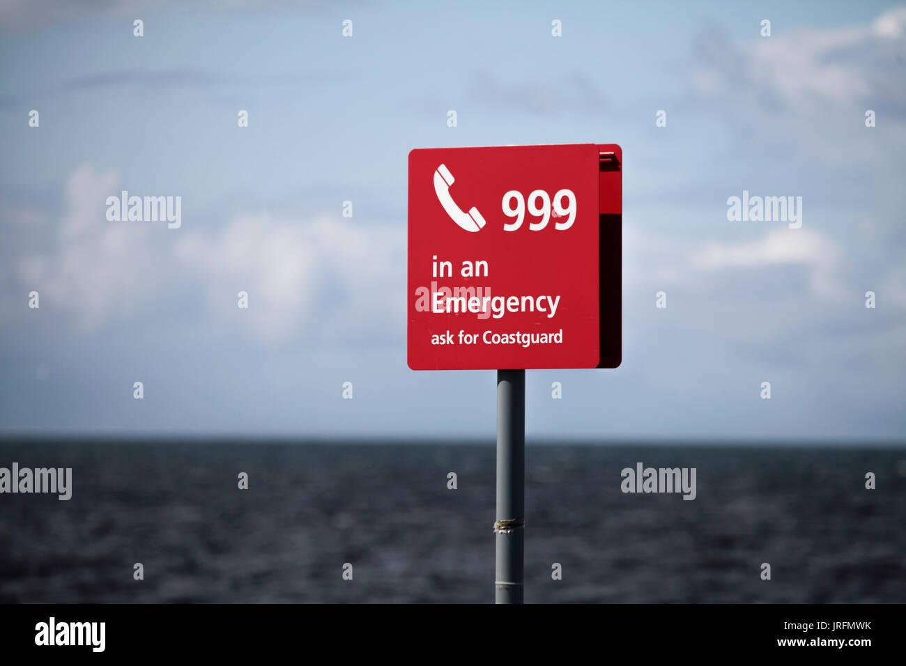 Call the coastguard 999 sign Stock Photo - Alamy