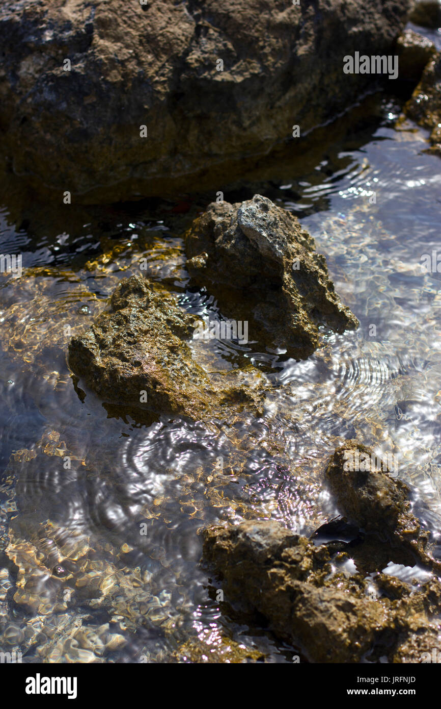 Stones on the beach at the sea under water Stock Photo - Alamy
