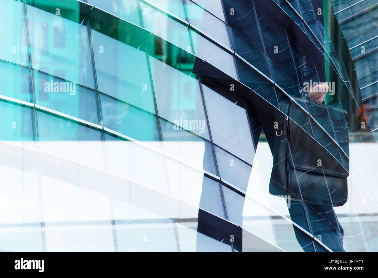 Abstract double exposure of businessman and office buildings, rush ...