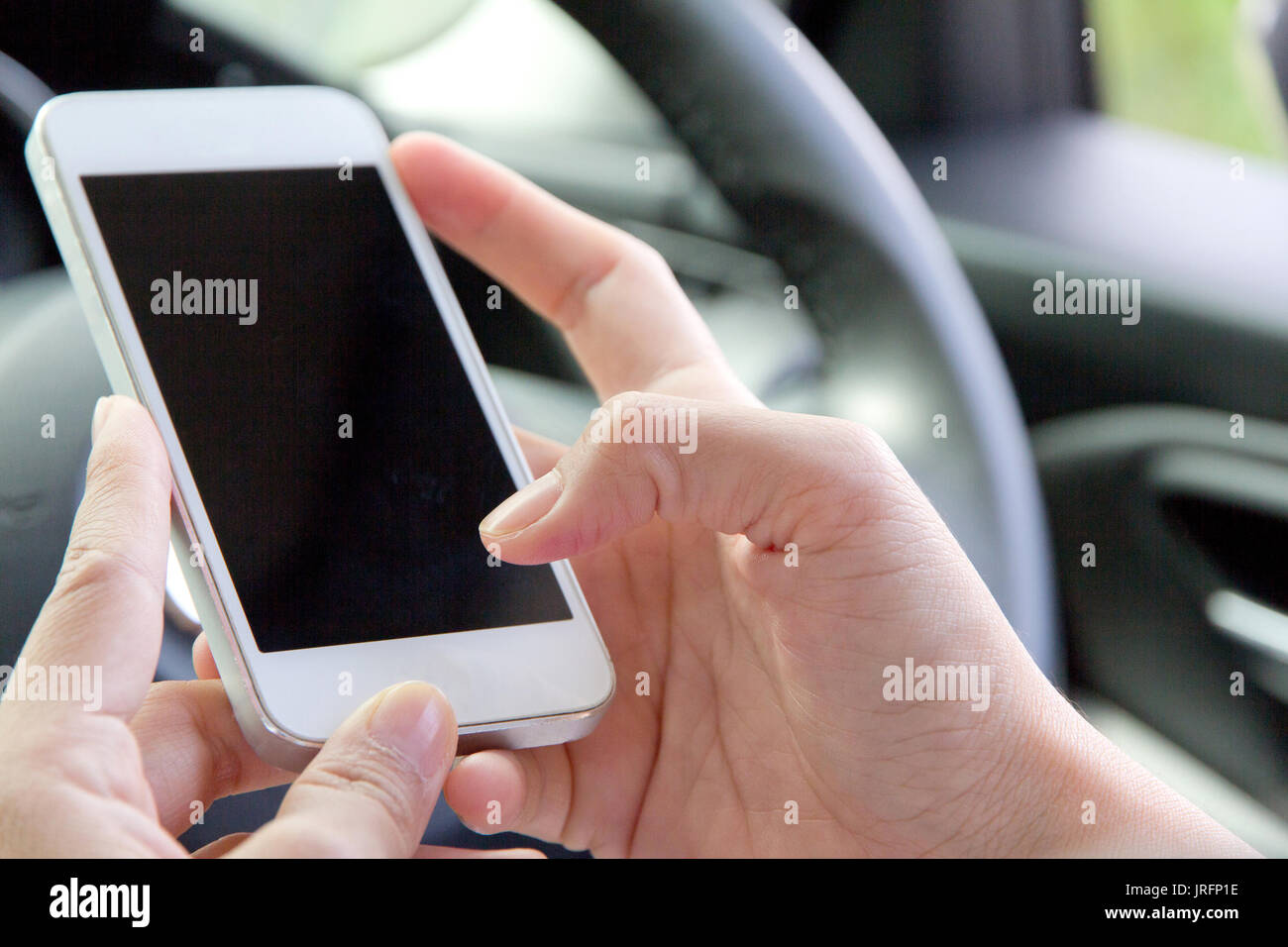 image of using a mobile phone inside of a car Stock Photo - Alamy