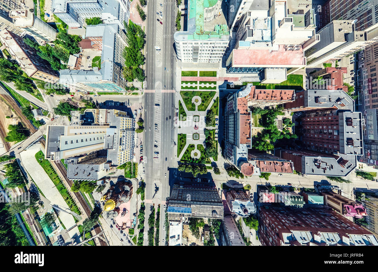 Aerial city view with crossroads and roads, houses, buildings, parks ...