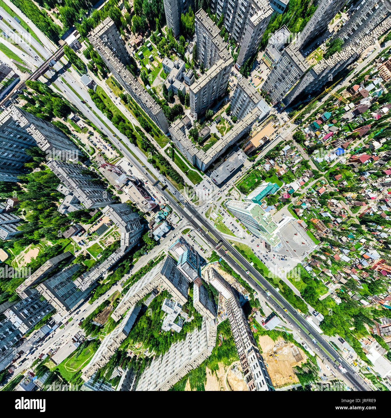 Aerial city view with crossroads and roads, houses, buildings, parks ...