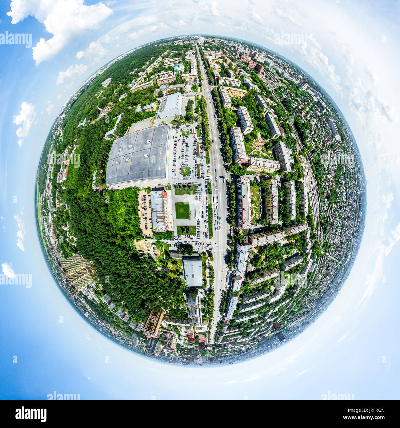 Aerial city view with crossroads and roads, houses, buildings, parks ...