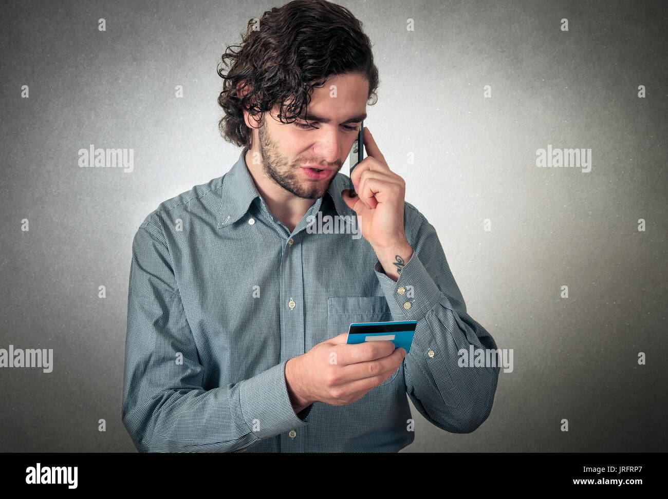Handsome male credit card phone hi-res stock photography and images - Alamy