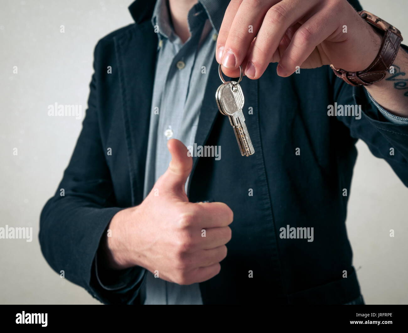 Man giving the new keys Stock Photo - Alamy
