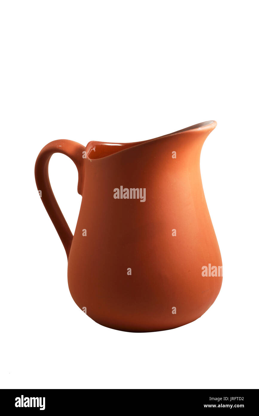 traditional brown ceramic jug on white background Stock Photo - Alamy