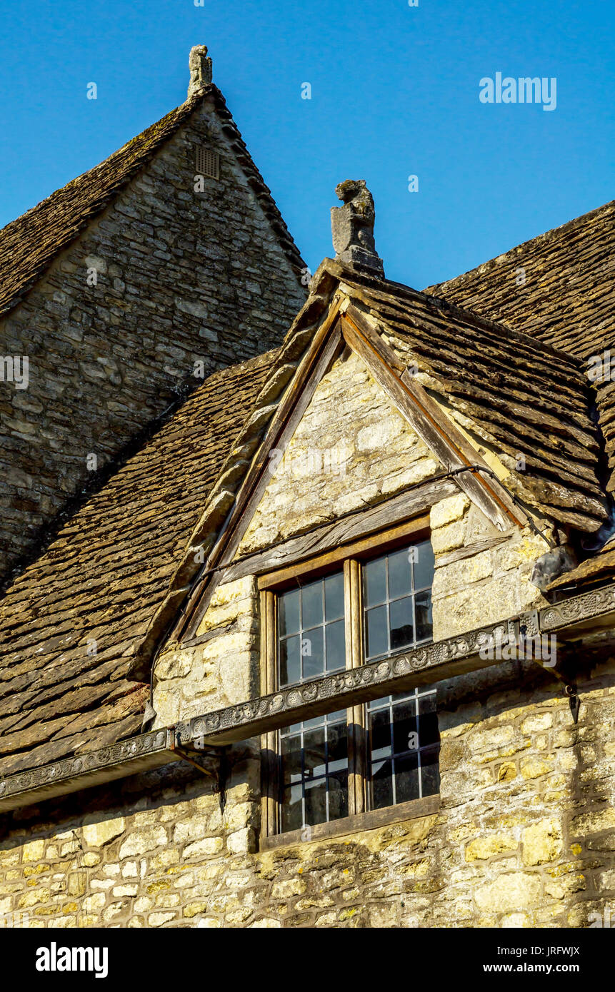 Old wooden window in a historic building, characteristic stone facade ...