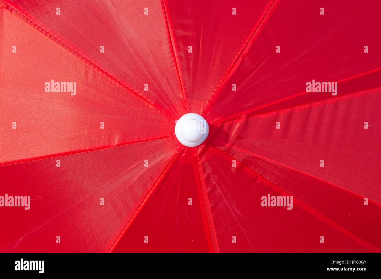 Red beach umbrella hi-res stock photography and images - Alamy