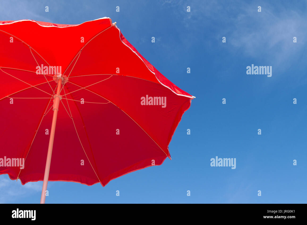 Red umbrella on a beach hi-res stock photography and images - Alamy