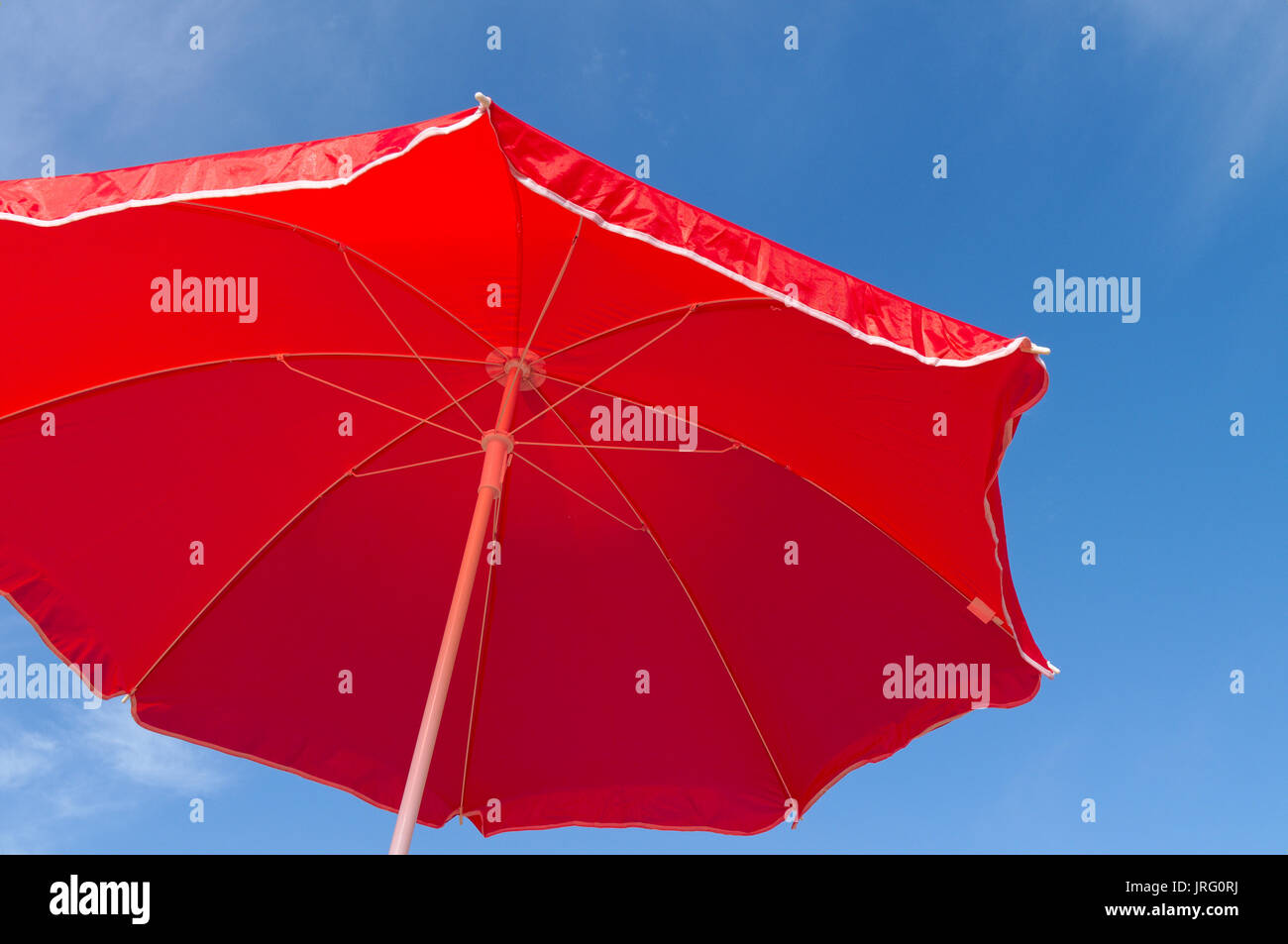 Holding red umbrella in sunny weather hi-res stock photography and ...