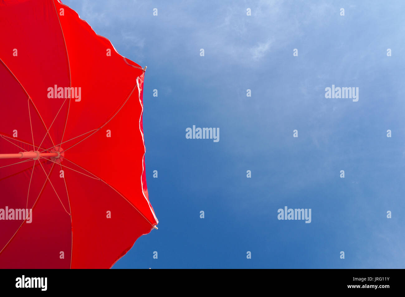 Red umbrella on a beach hi-res stock photography and images - Alamy