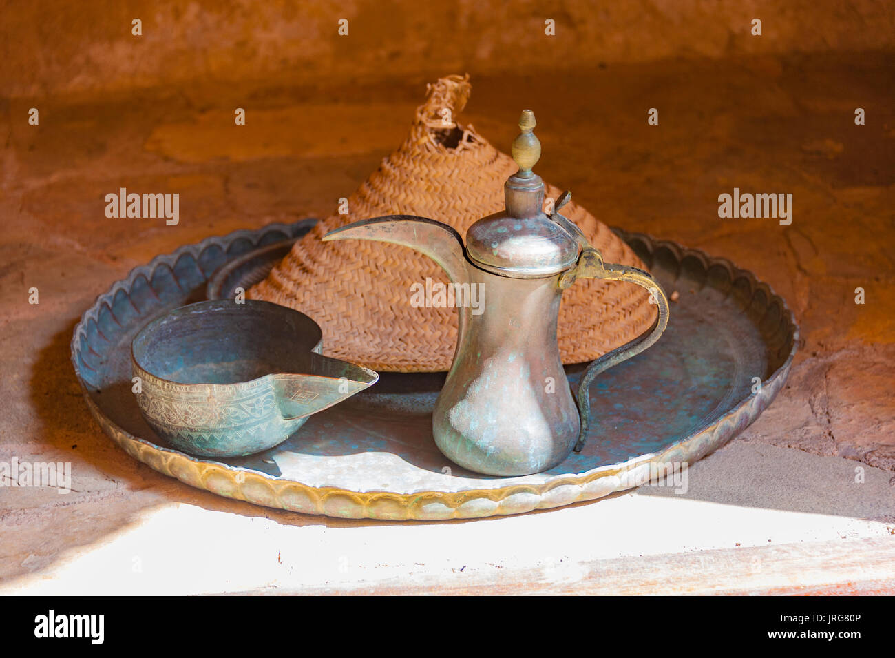 Arabic coffee pot and water ladle - OMAN Stock Photo - Alamy