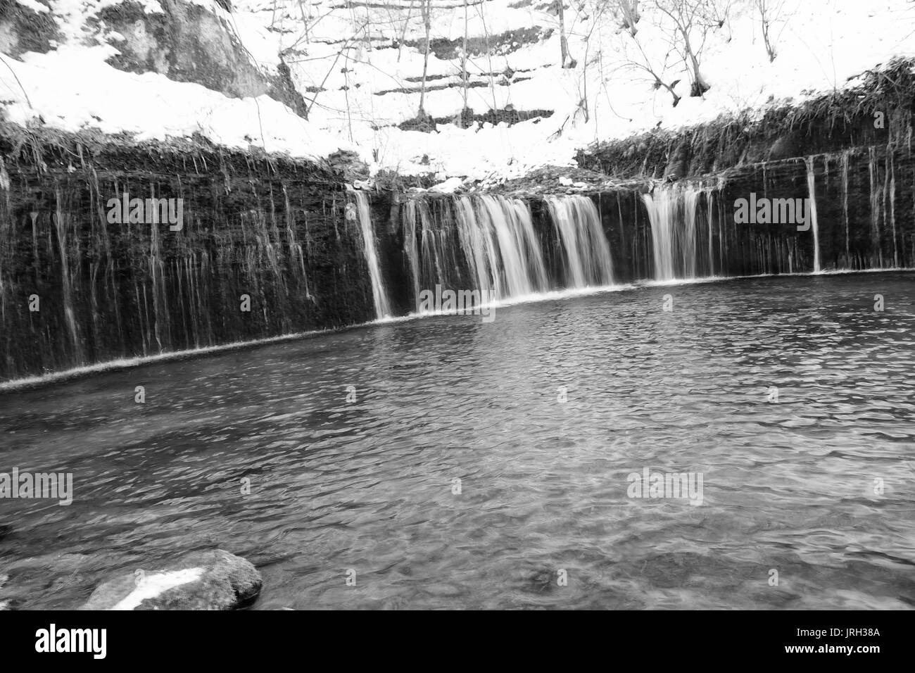 Beautiful Shiraito Waterfall at the base of volcanic mountain in ...
