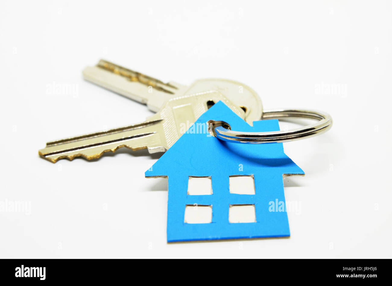 House keys with blue house keychain isolated Stock Photo - Alamy