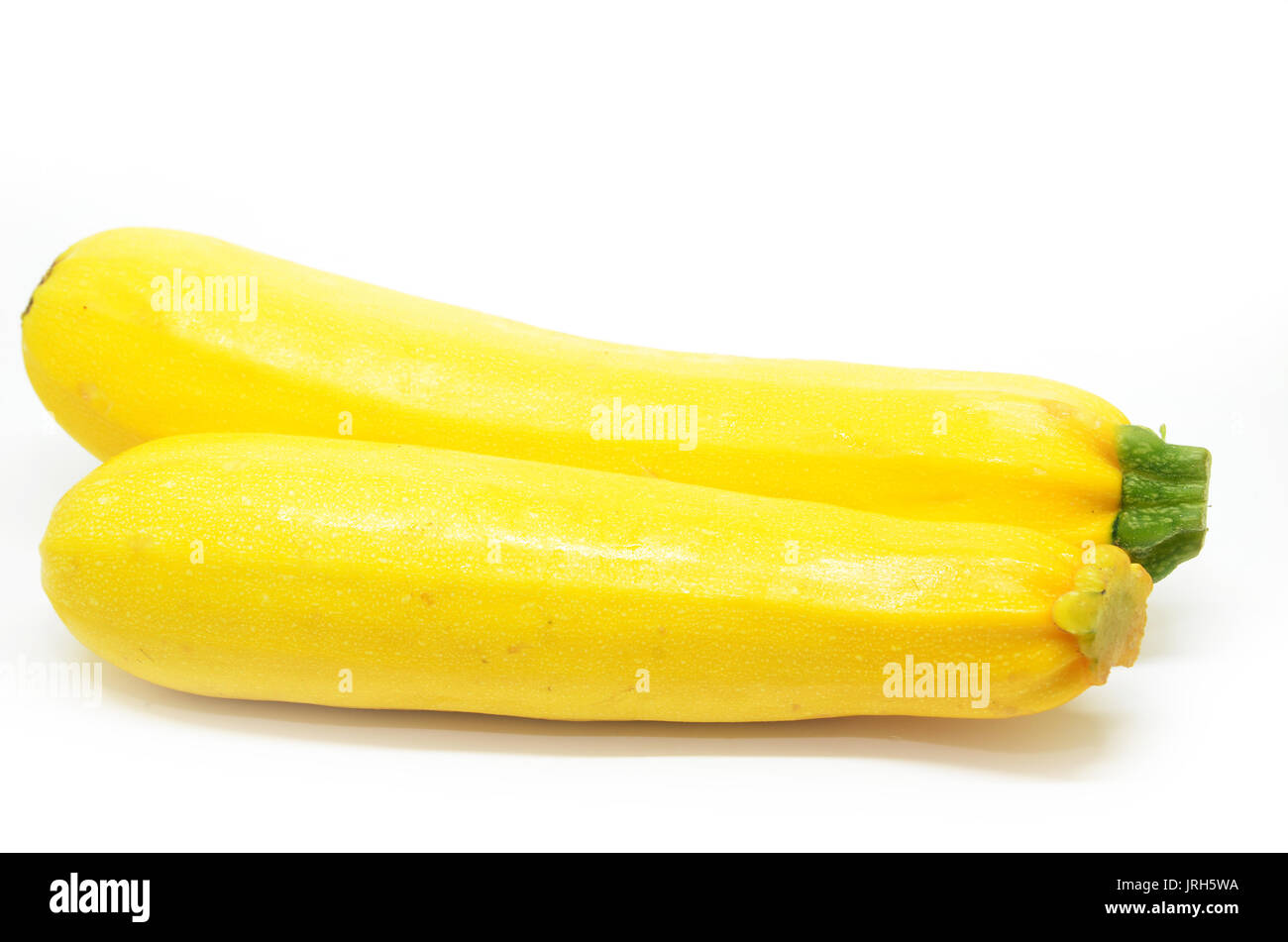Two ripe yellow courgettes isolated on a white background Stock Photo ...
