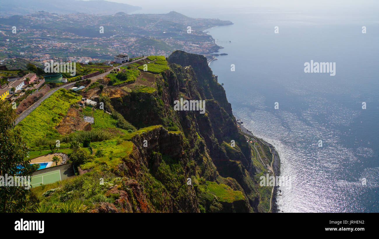 Madeira - Green cliffs with blue ocean and the City of funchal from ...