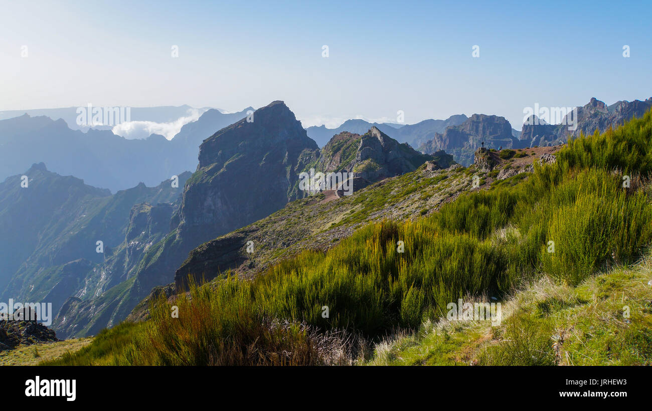 Madeira - Rocks of mountain Pico do Arieiro with green meadows and ...