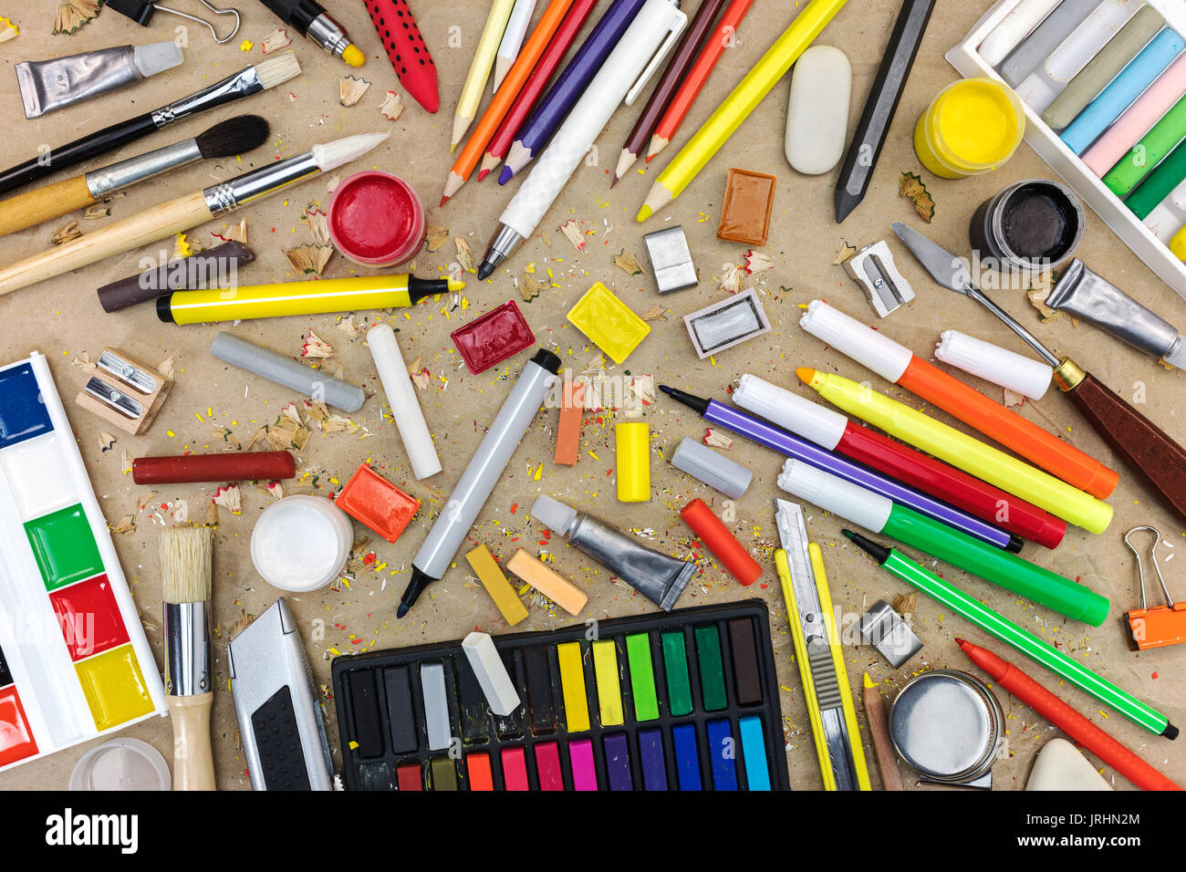 colorful school supplies on recycled paper background: watercolor ...