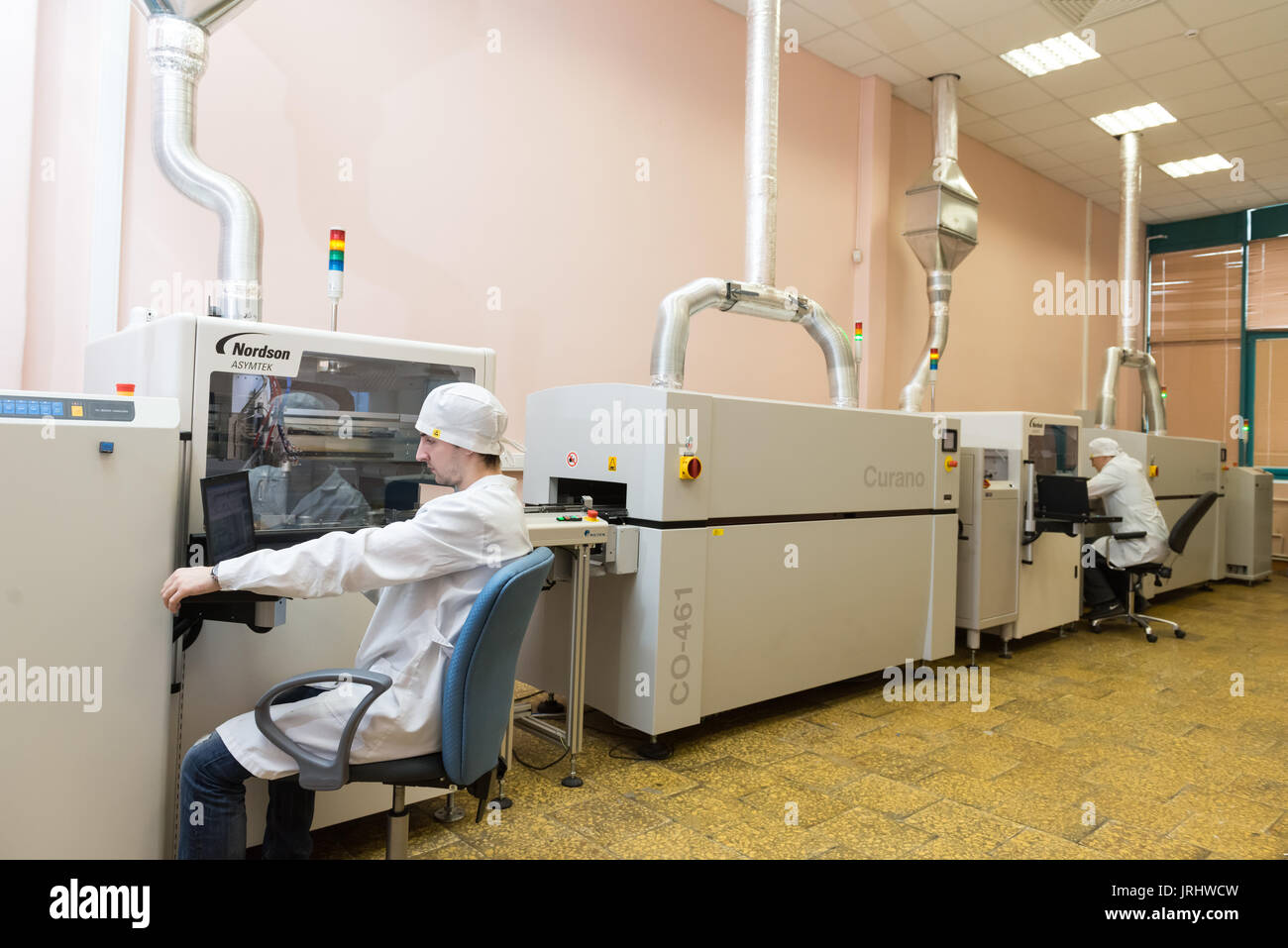 Production of electronic components at high-tech factory Stock Photo ...