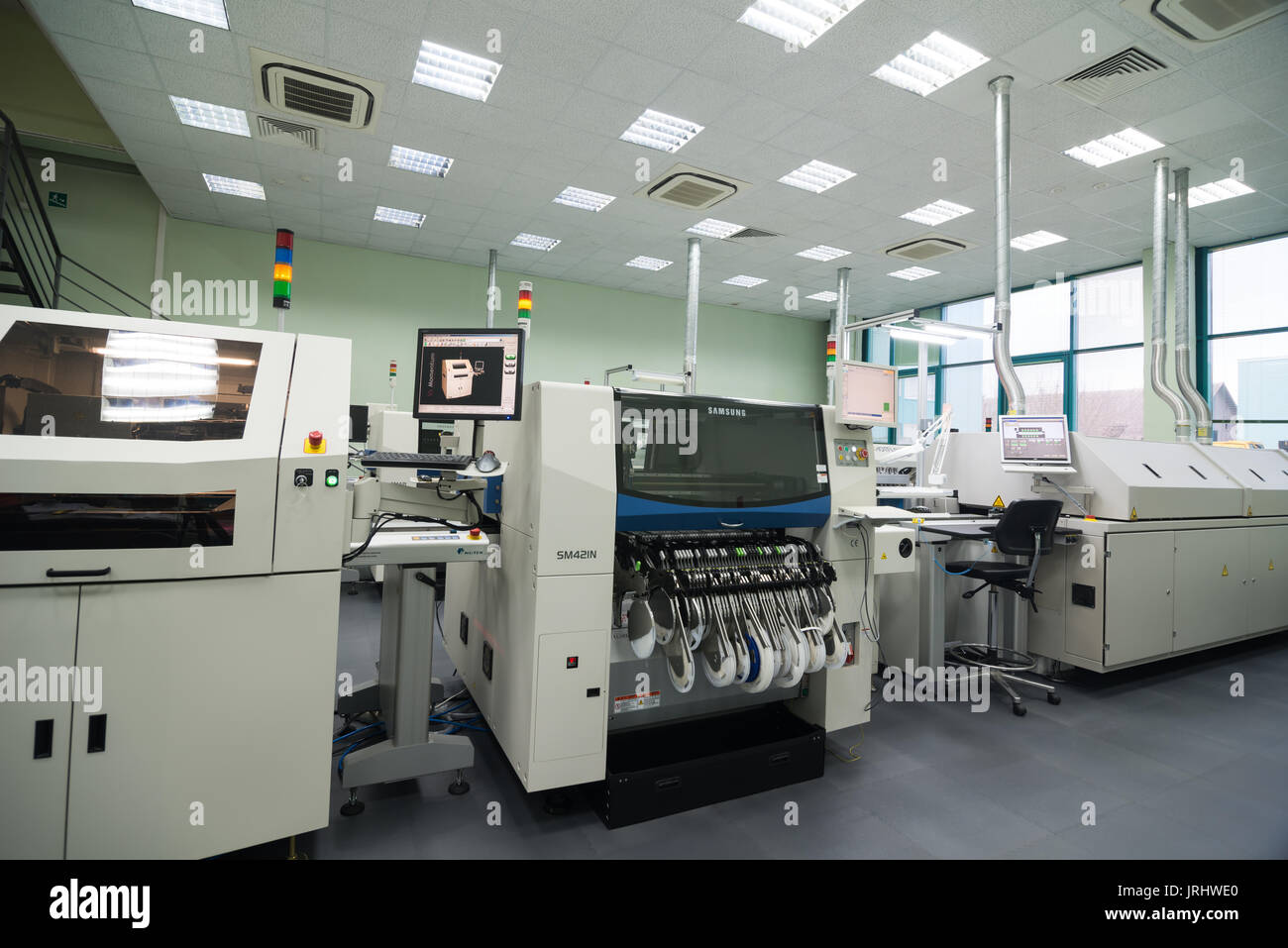 Production of electronic components at high-tech factory Stock Photo ...