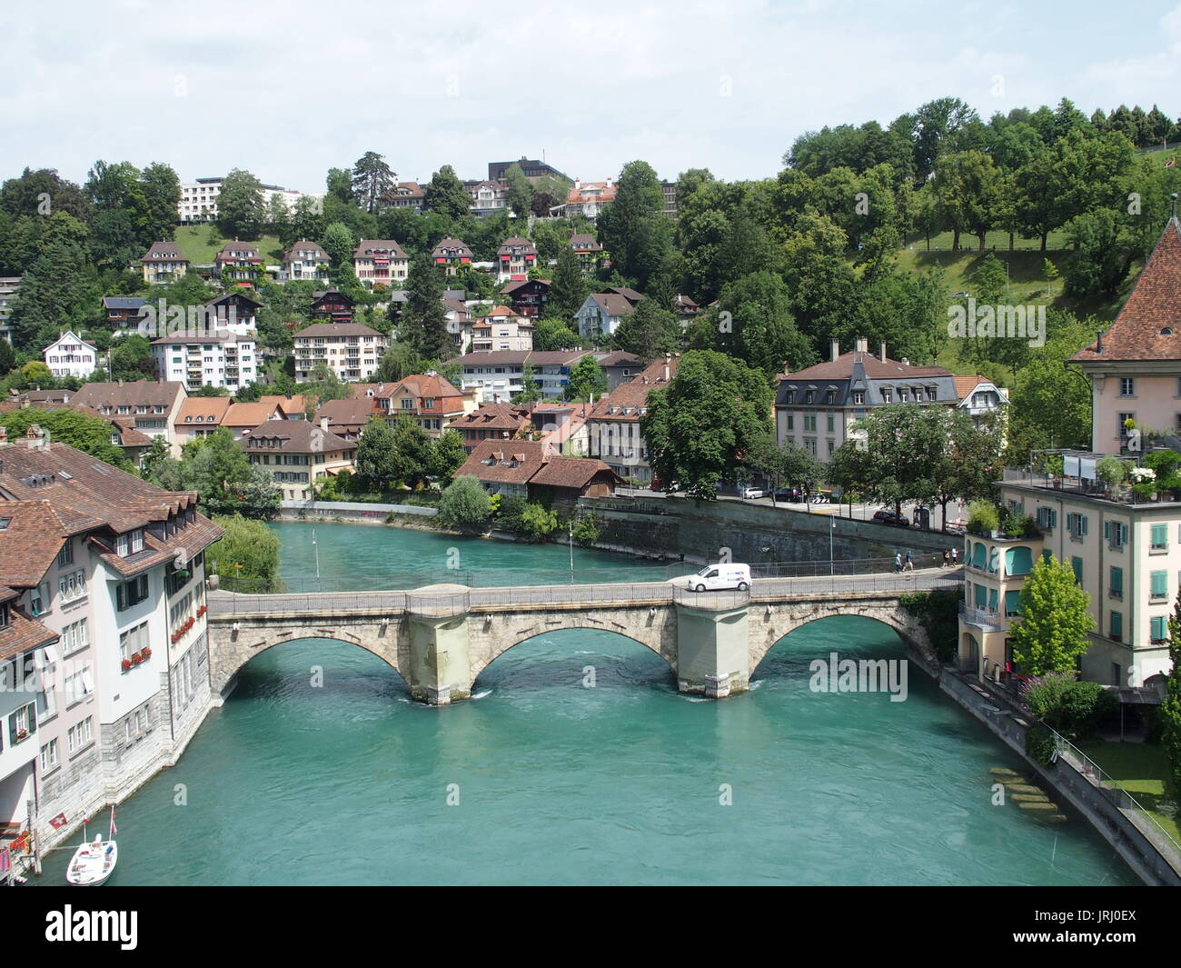 Stony bridge over clean alpine Aare river in city of Bern in ...