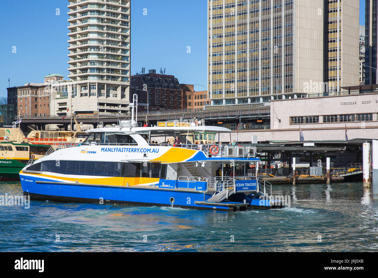 Manly fast ferry leaving the ferry terminus at Circular Quay in Sydney ...