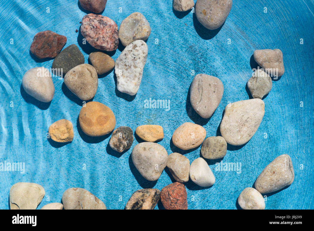pebble stones in water closeup Stock Photo - Alamy