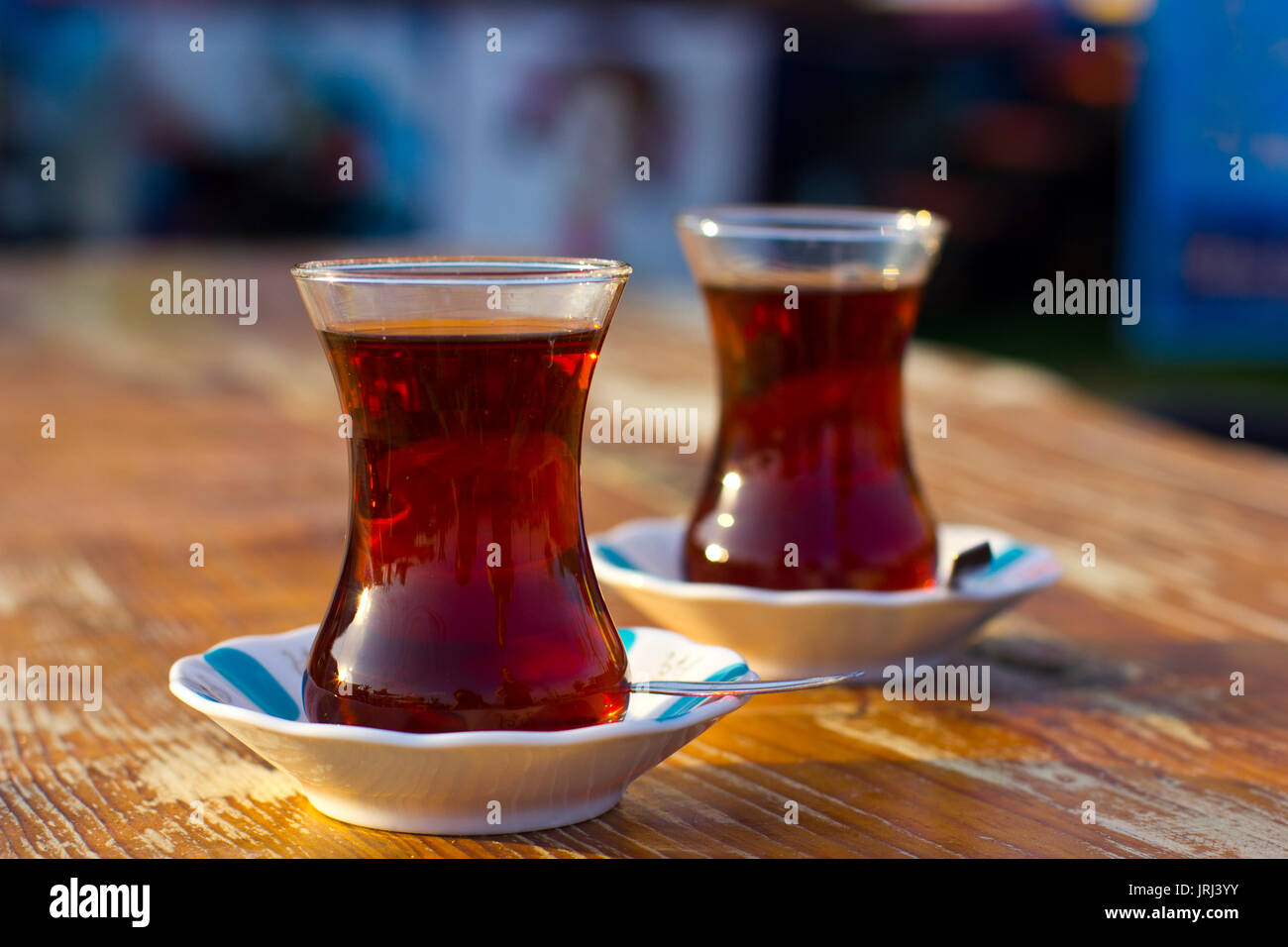 Black turkish tea in the traditional glass on the table Stock Photo - Alamy
