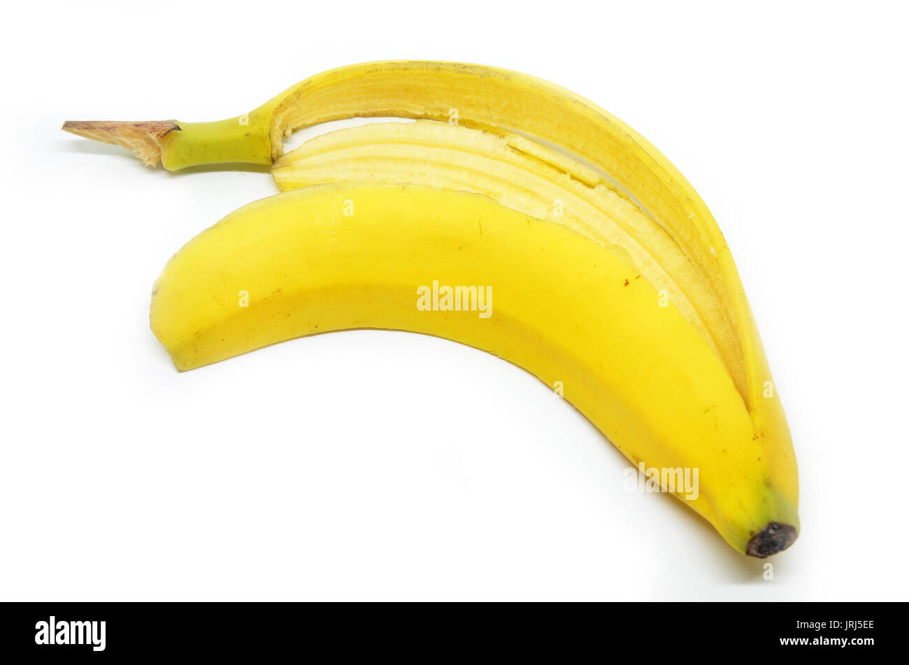 Slippery banana skin on a white background Stock Photo - Alamy