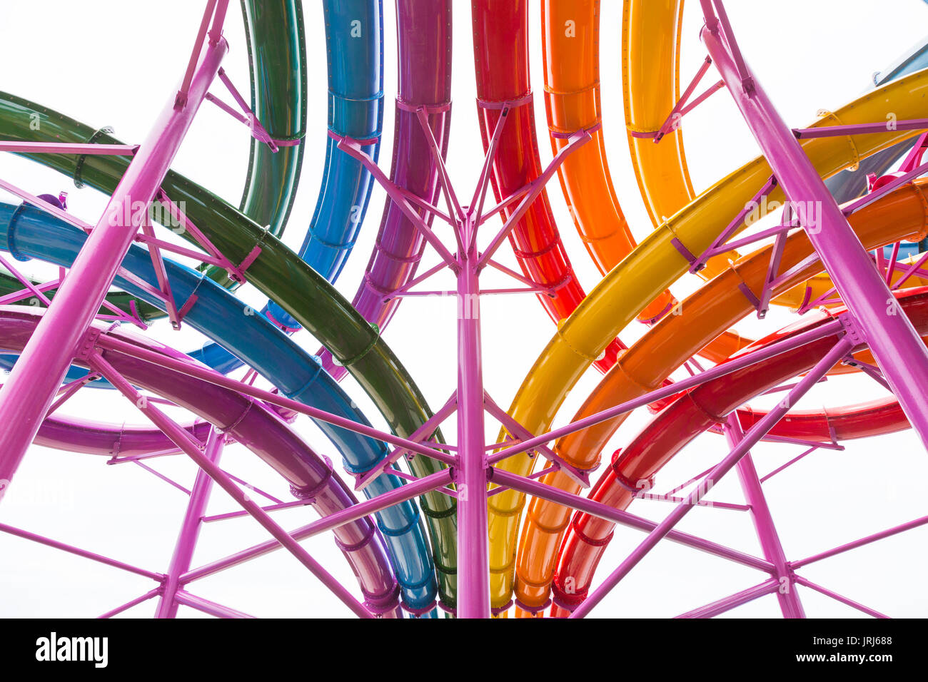 colorful water tube ride structure view against white sky view in ...