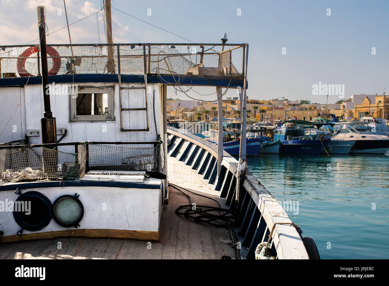 Trip on a Fishing Boat. A view of a typical fishing village in Malta ...
