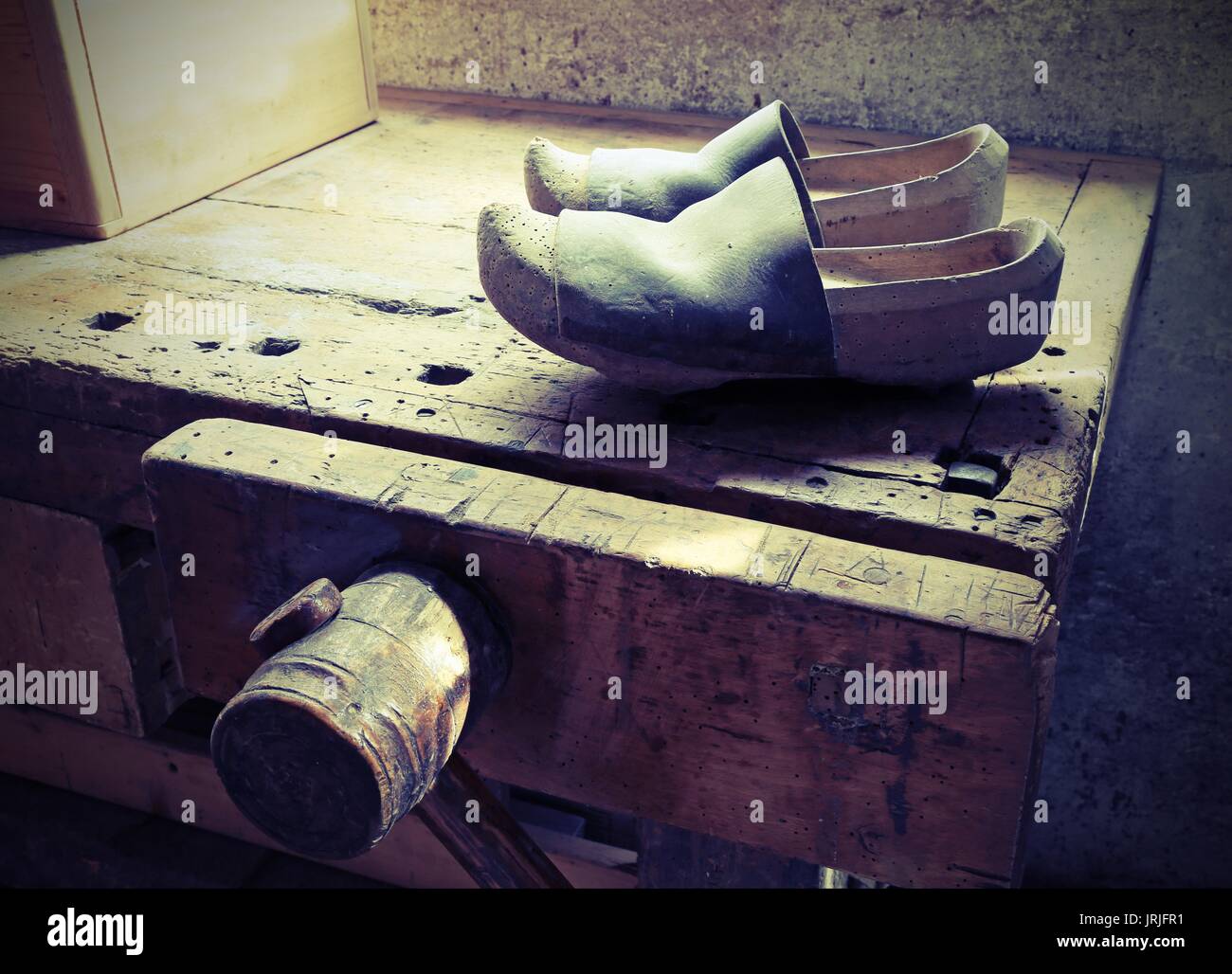 Very old DUTCH handmade wooden clogs in the woodworking workshop Stock ...