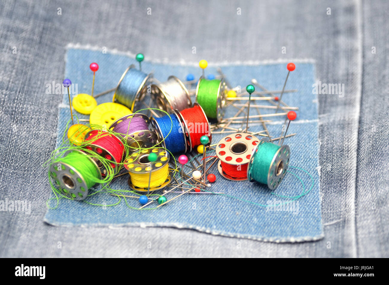 sewing kit on jeans textile Stock Photo - Alamy
