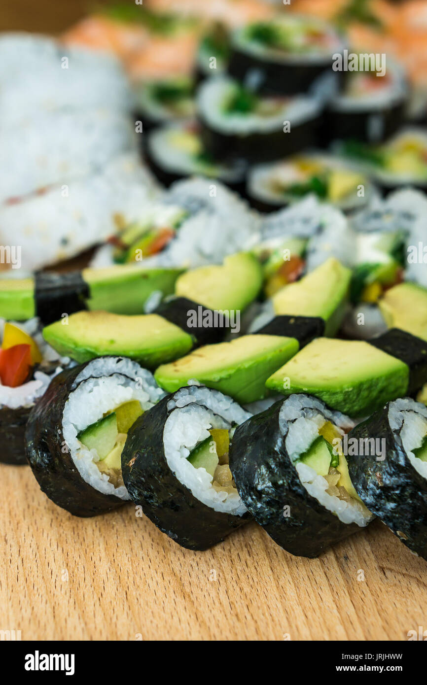 Eating homemade sushi with friends Stock Photo - Alamy