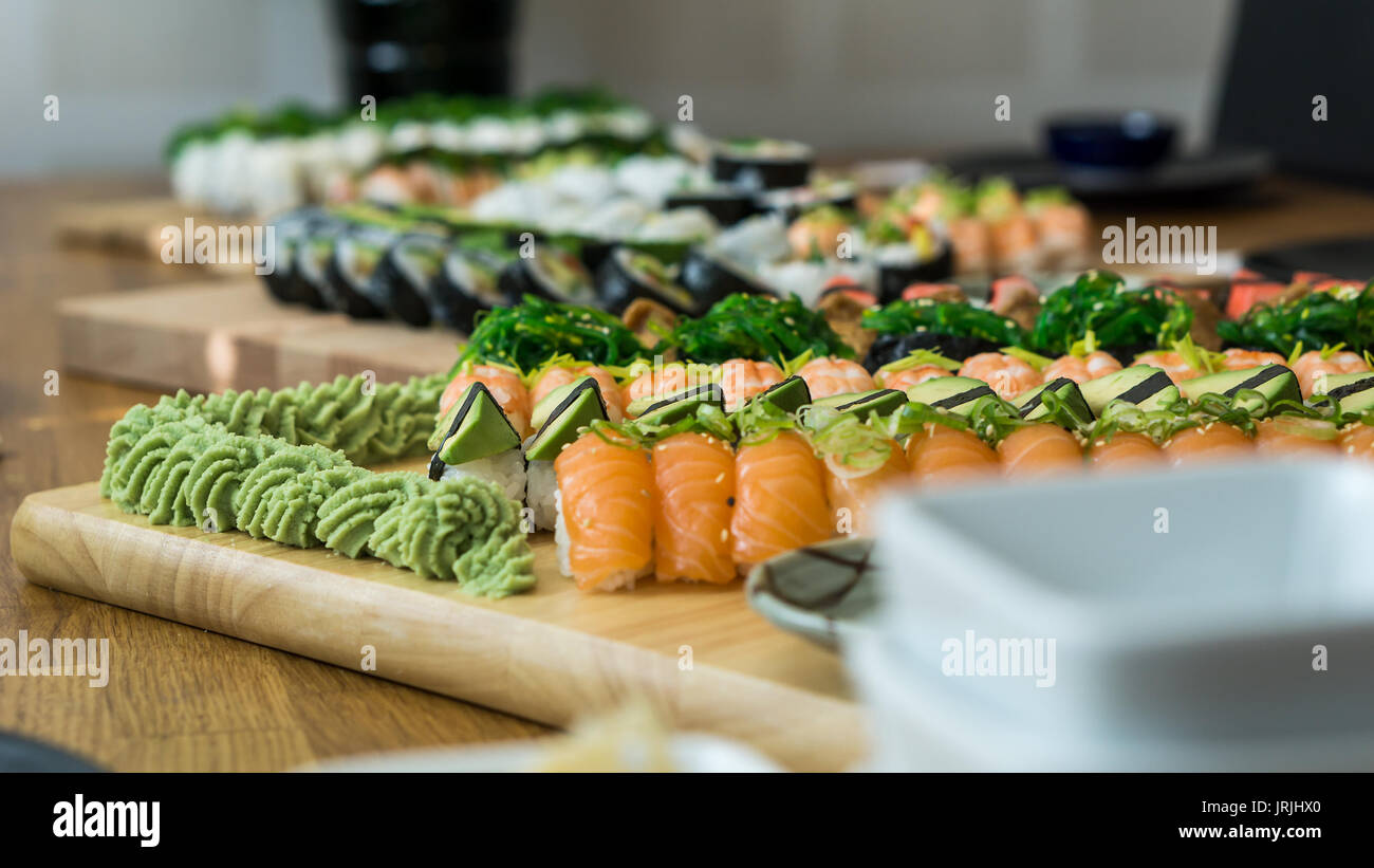Eating homemade sushi with friends Stock Photo - Alamy