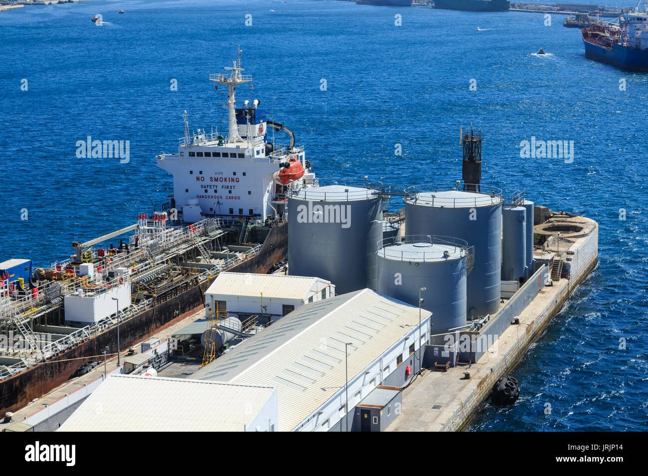 Fuel Tanks and Tanker in Gibralter Harbor Stock Photo - Alamy
